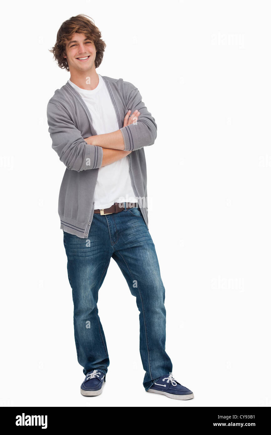 Smiling male student posing with crossed arms Stock Photo - Alamy