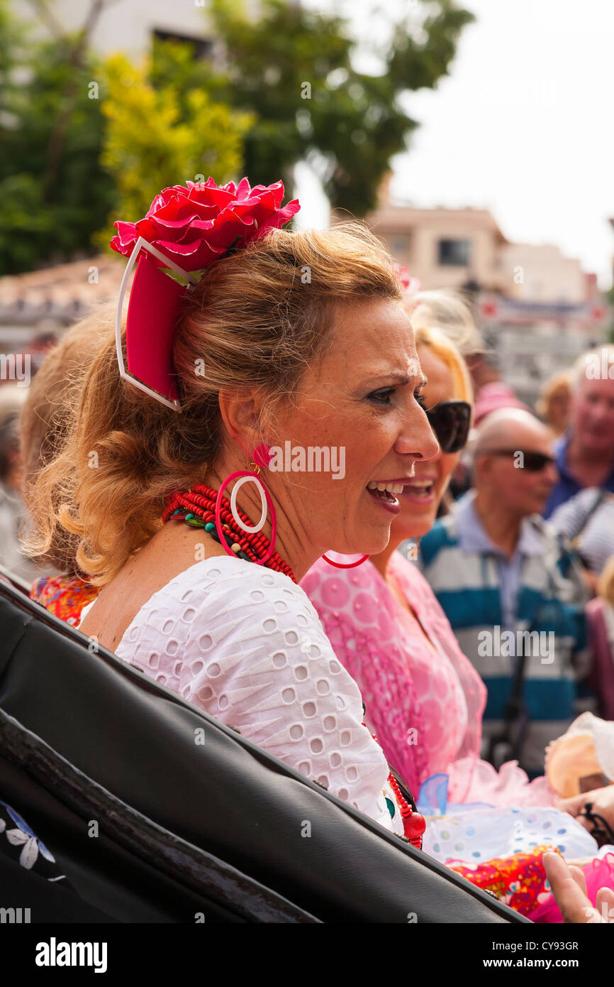 Spanish ladies ride in a carriage dressed in Spanish dress. Religious ...