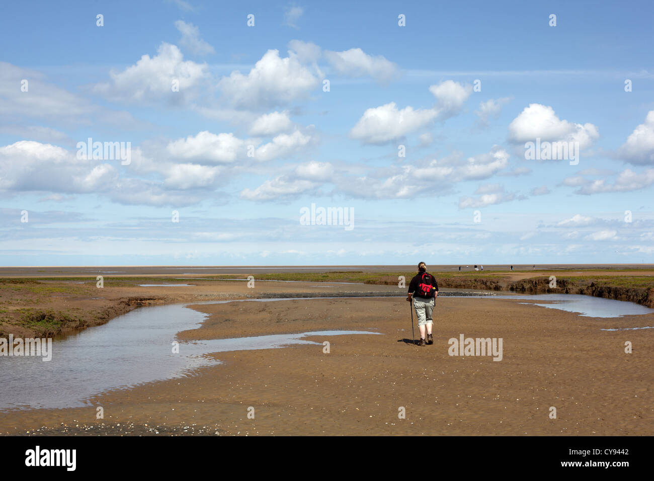 Walker on the beach at Stiffkey Marshes, Norfolk, September 2011 Stock ...