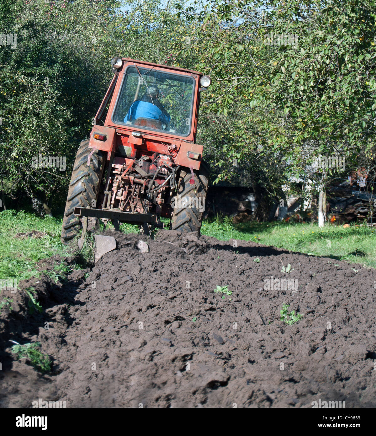 red old tractor in autumn on field Stock Photo - Alamy