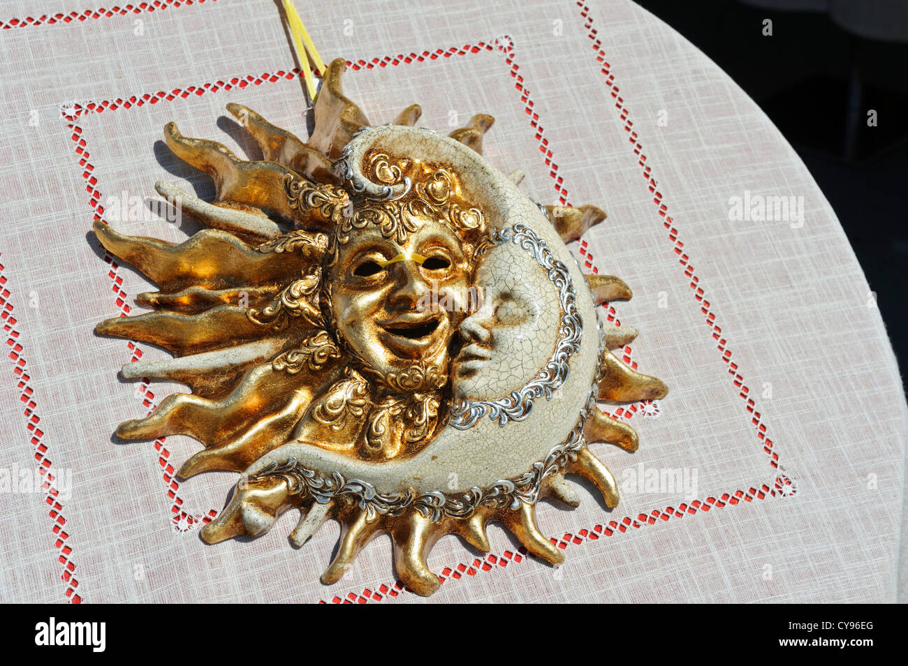 Venetian handcraft with Moon and Sun, Burano, Venice, Italy Stock Photo ...