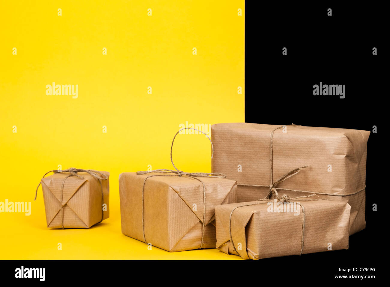 several packages wrapped with paper Stock Photo - Alamy