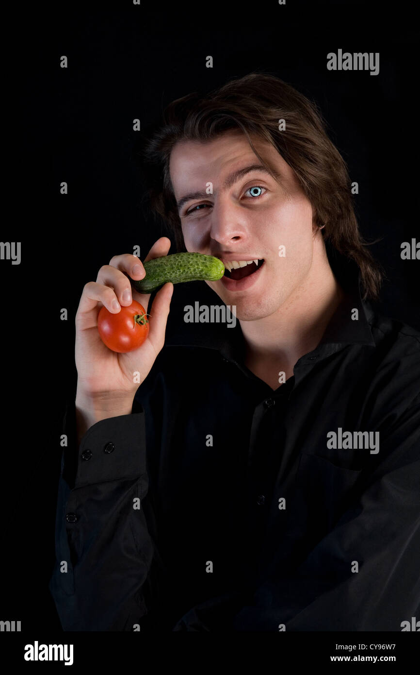 Funny vegetarian vampire with vegetables, healthy eating concept ...