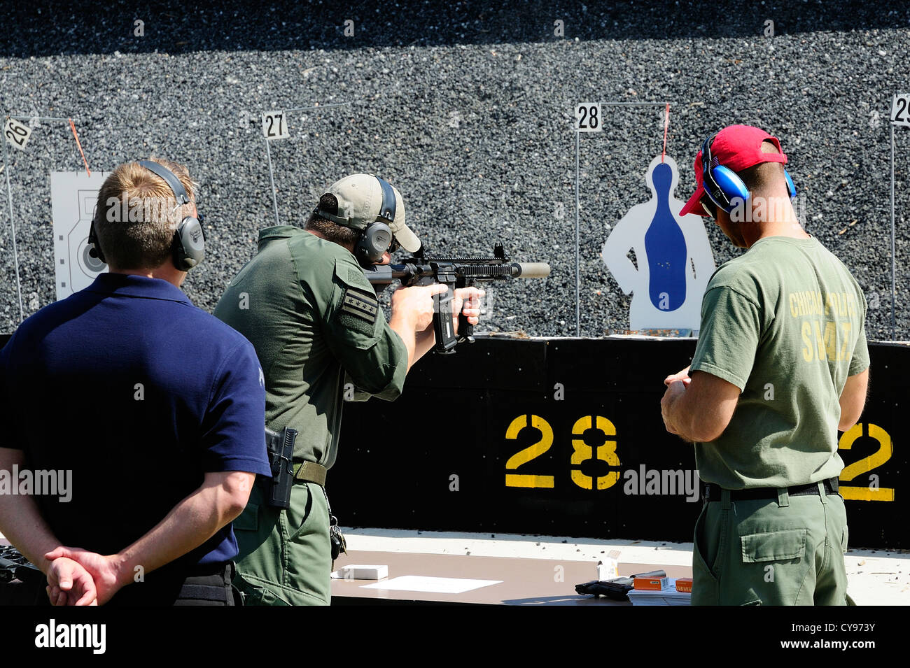 Gunman test firing automatic rifle at the FBI shooting range in Chicago ...