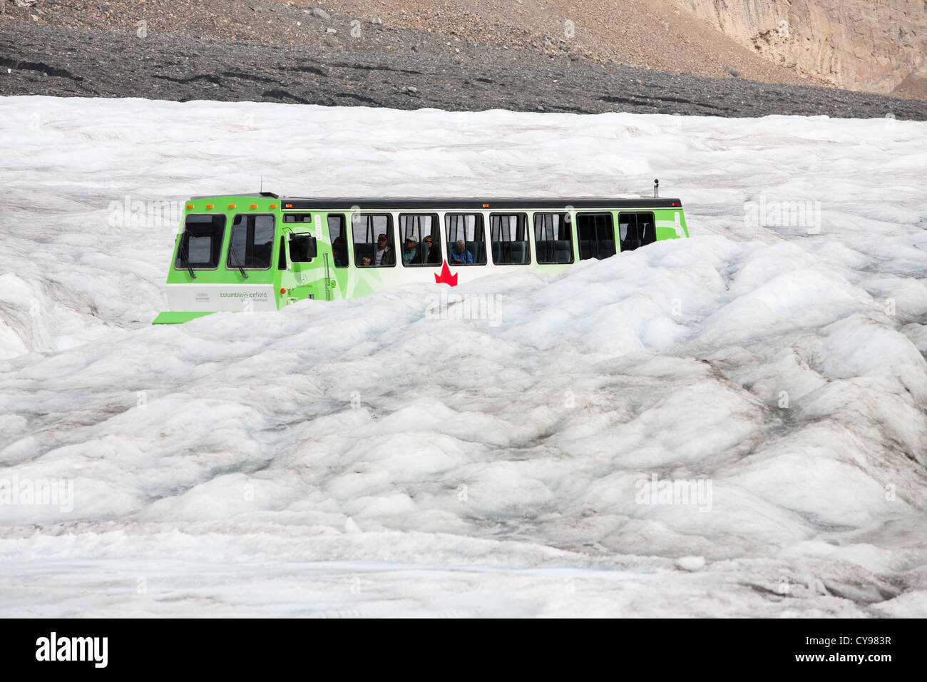 Tourist ice buggy's on the Athabasca glacier which is receding ...