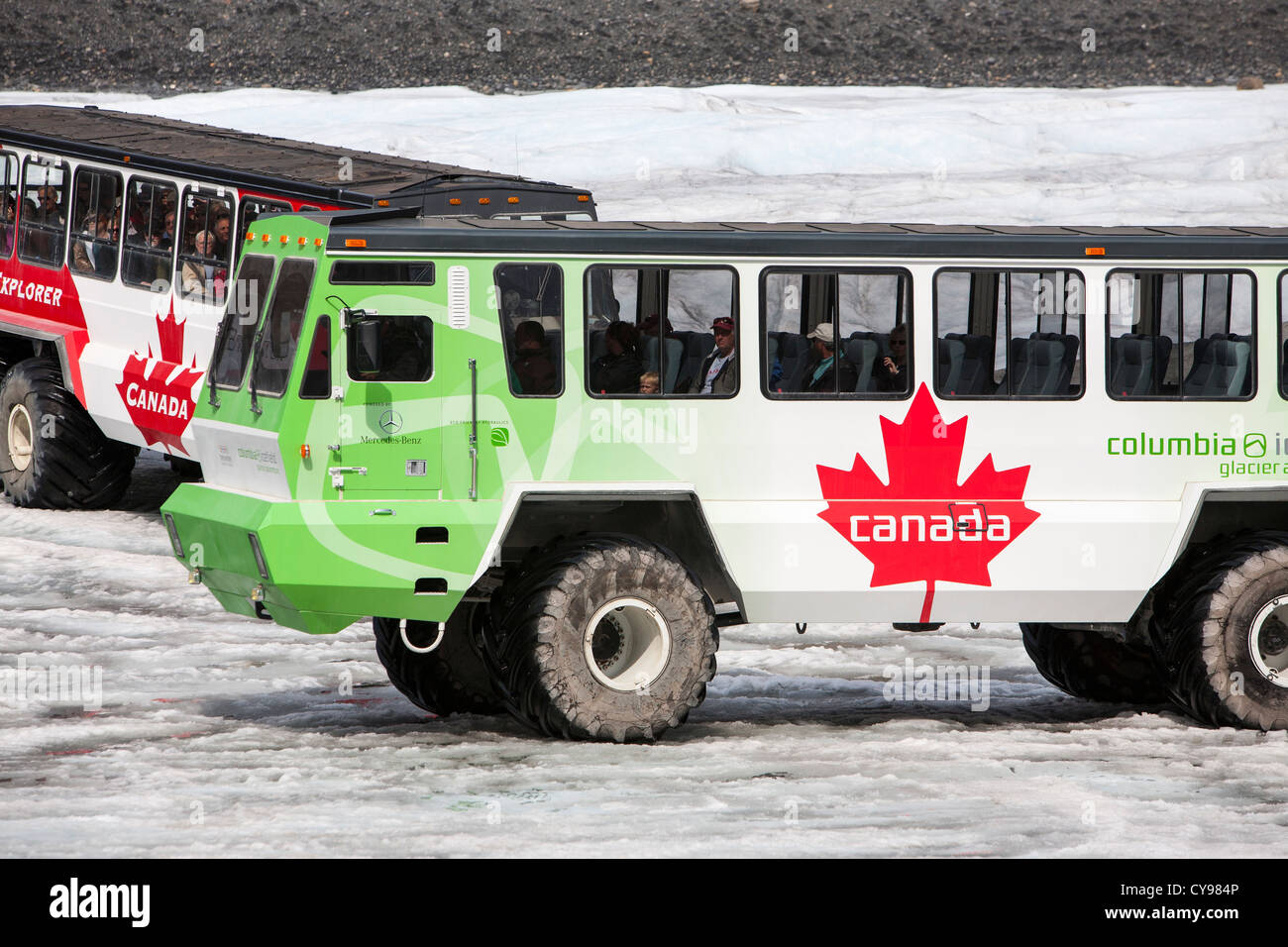 Tourist ice buggy's on the Athabasca glacier which is receding ...