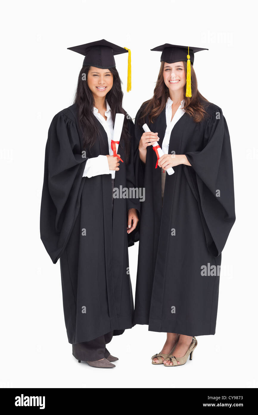 Full length shot of two women graduating Stock Photo - Alamy