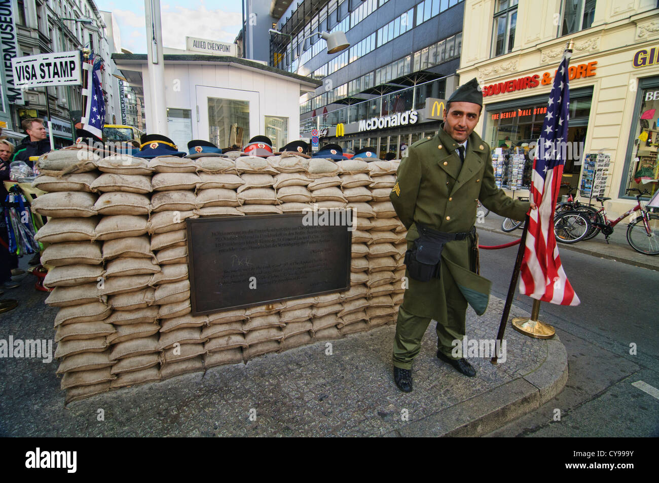soldier at Checkpoint Charlie historical site in Berlin, Germany Stock ...