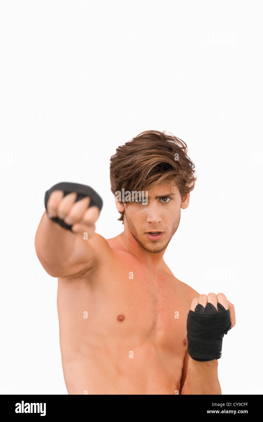 Martial arts fighter in offensive pose Stock Photo - Alamy
