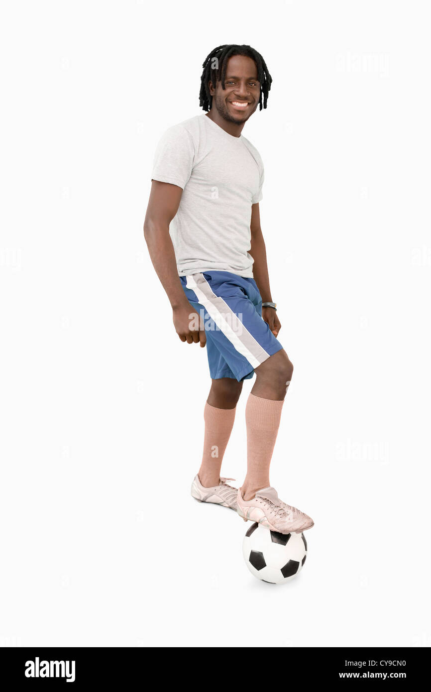 Smiling male football player Stock Photo - Alamy