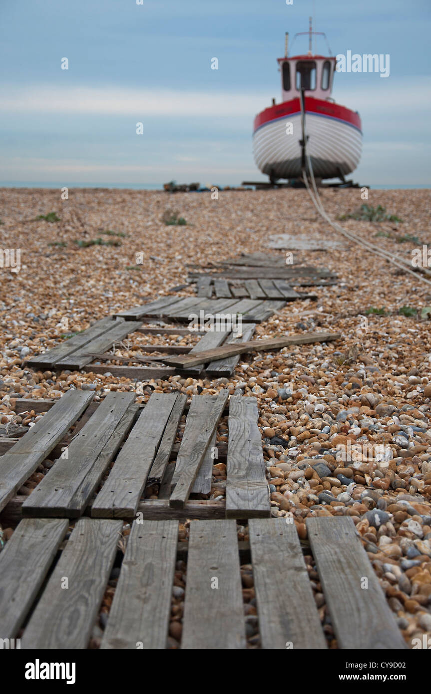 Beach Path leading to fishing boat Stock Photo - Alamy
