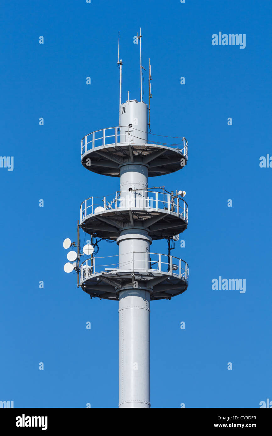 Communication mast for various uses against blue sky background Stock ...