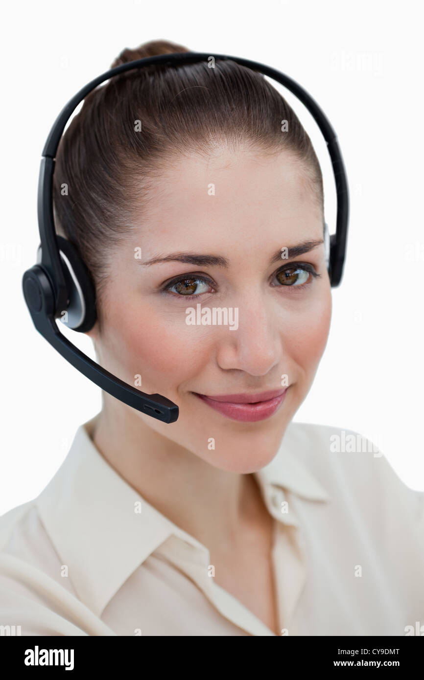 Portrait of a smiling operator posing with a headset Stock Photo - Alamy