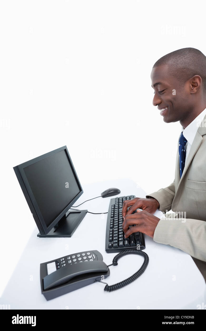 Side view of a businessman using a computer Stock Photo - Alamy
