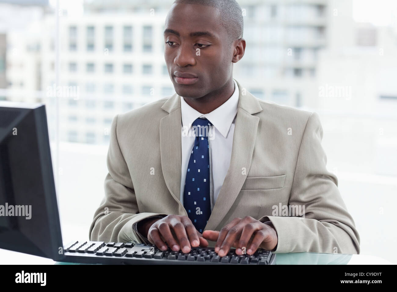 Office worker using a computer Stock Photo - Alamy