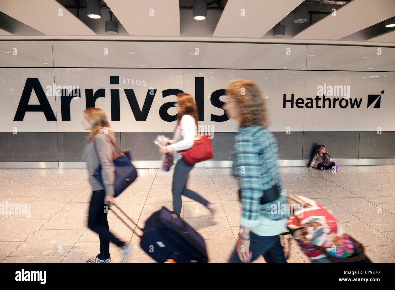 Air passengers arriving at Arrivals, Terminal 5 T5, Heathrow airport ...