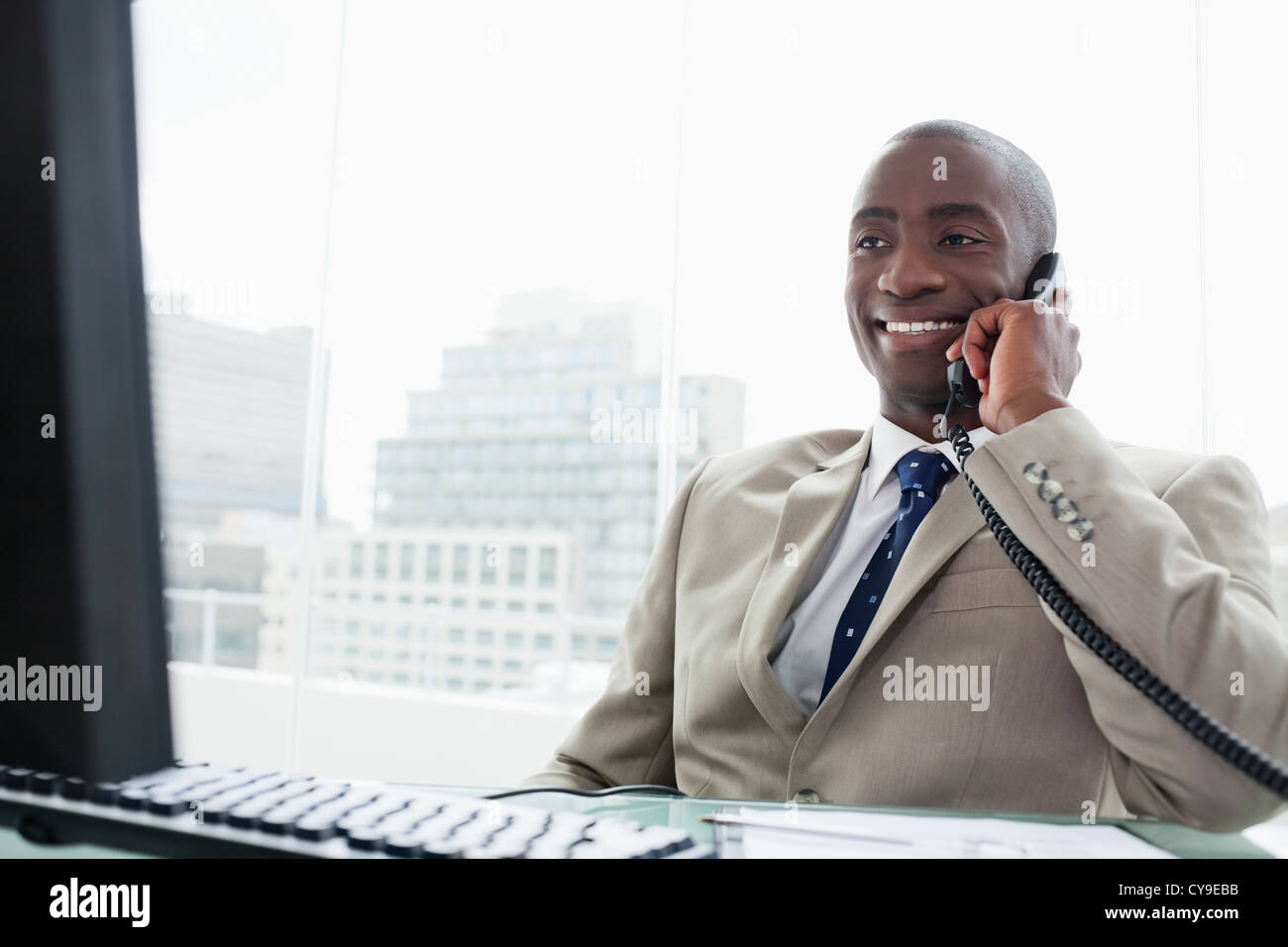 Smiling businessman on the phone Stock Photo - Alamy