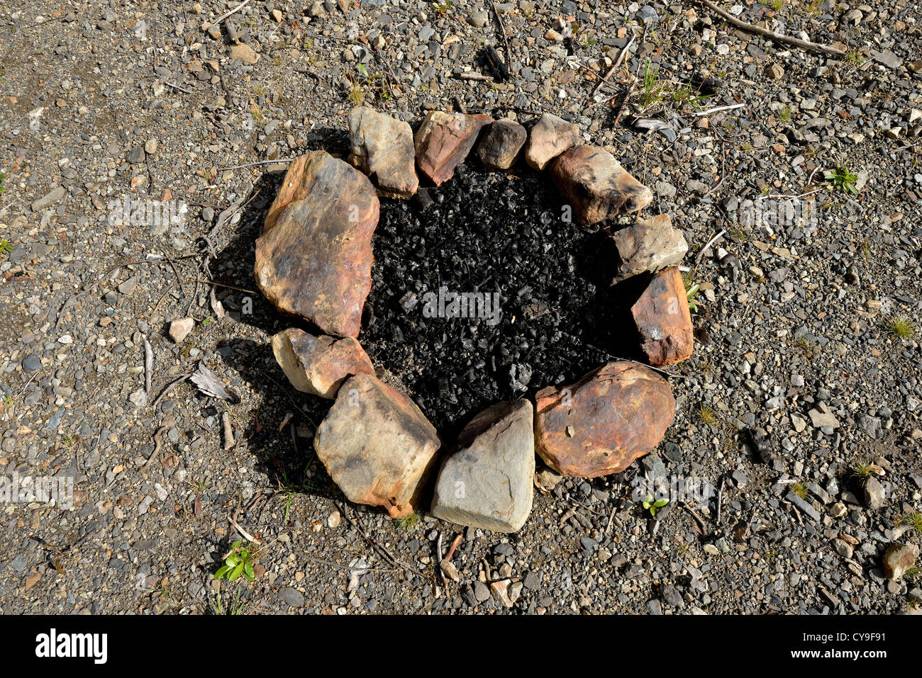 A stone circle used to surround a campfire Stock Photo - Alamy