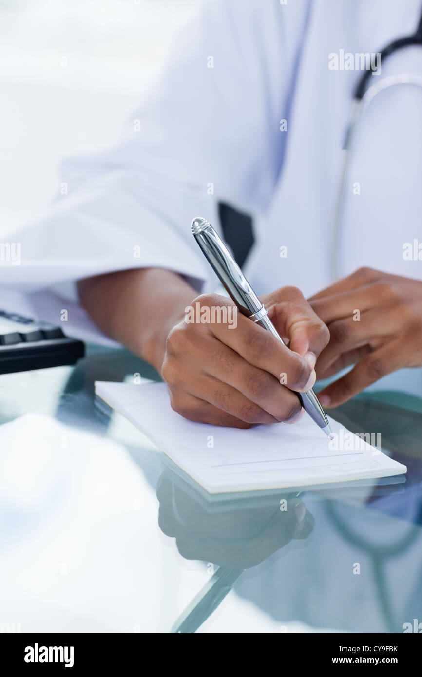 Portrait of a feminine hand writing a prescription Stock Photo - Alamy