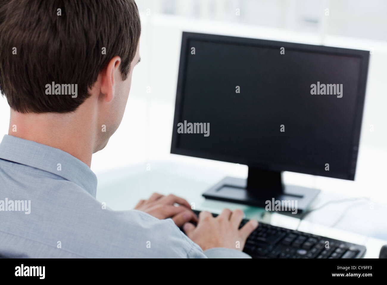 Back view of a man on computer hi-res stock photography and images - Alamy