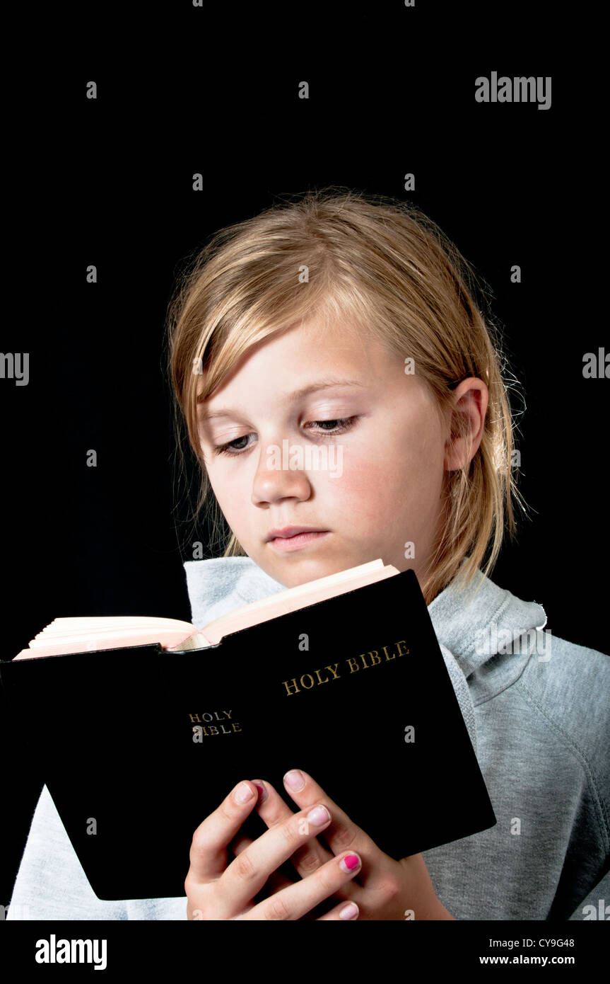 Child reading bible hi-res stock photography and images - Alamy