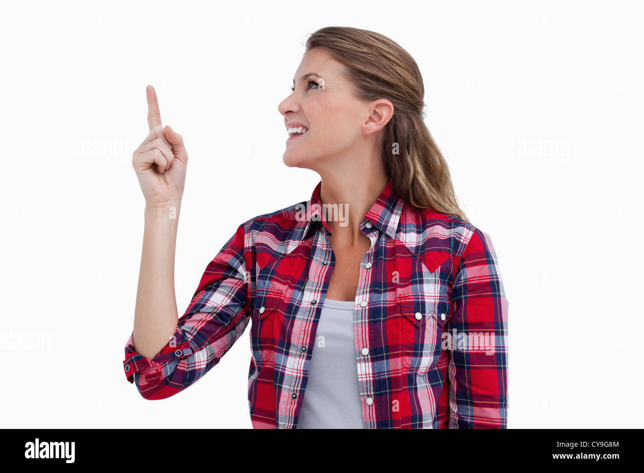 Smiling woman pointing at a copy space Stock Photo - Alamy