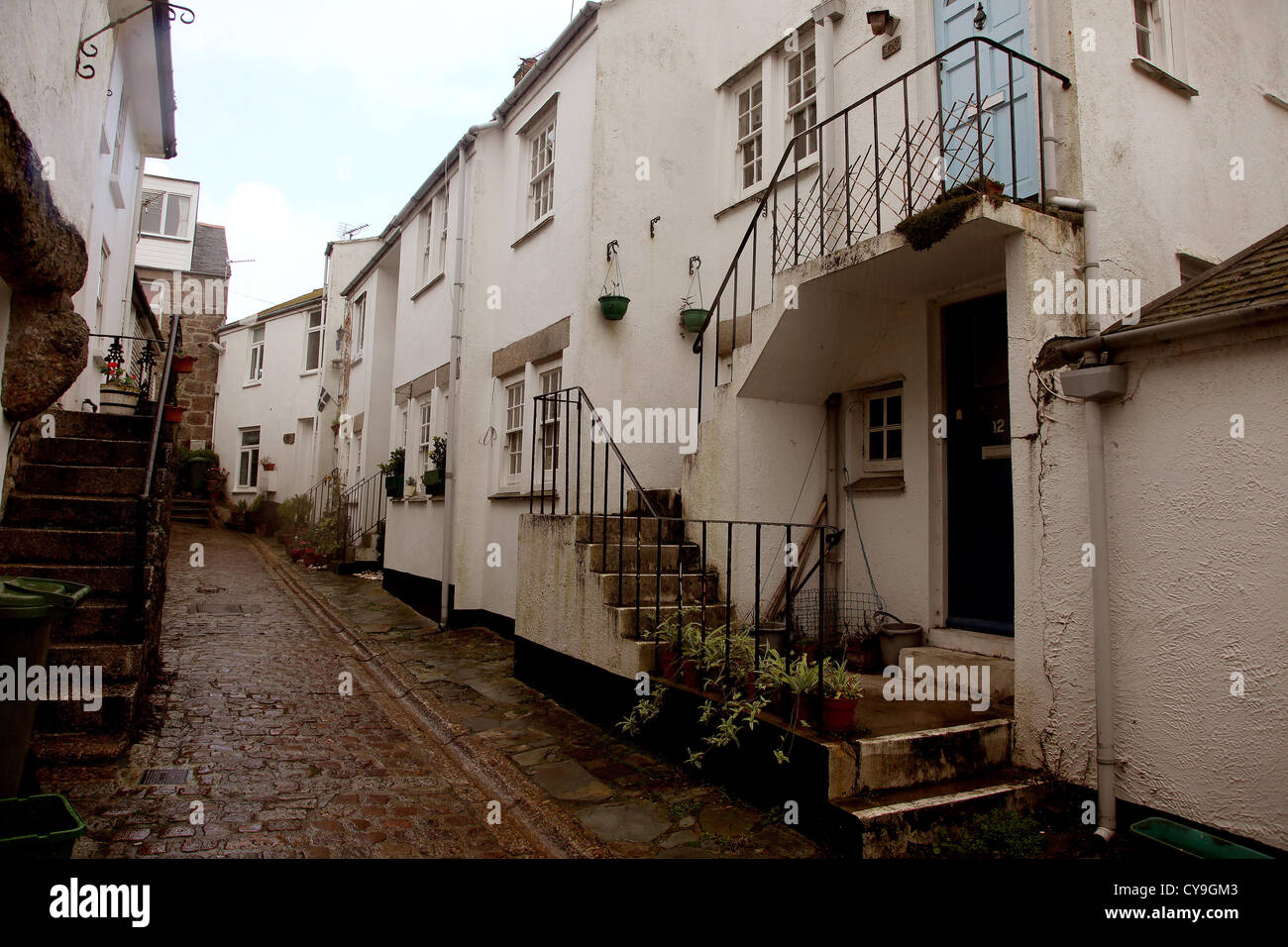 Old cobbled back streets on a wet day in St Ives Cornwall, England UK ...