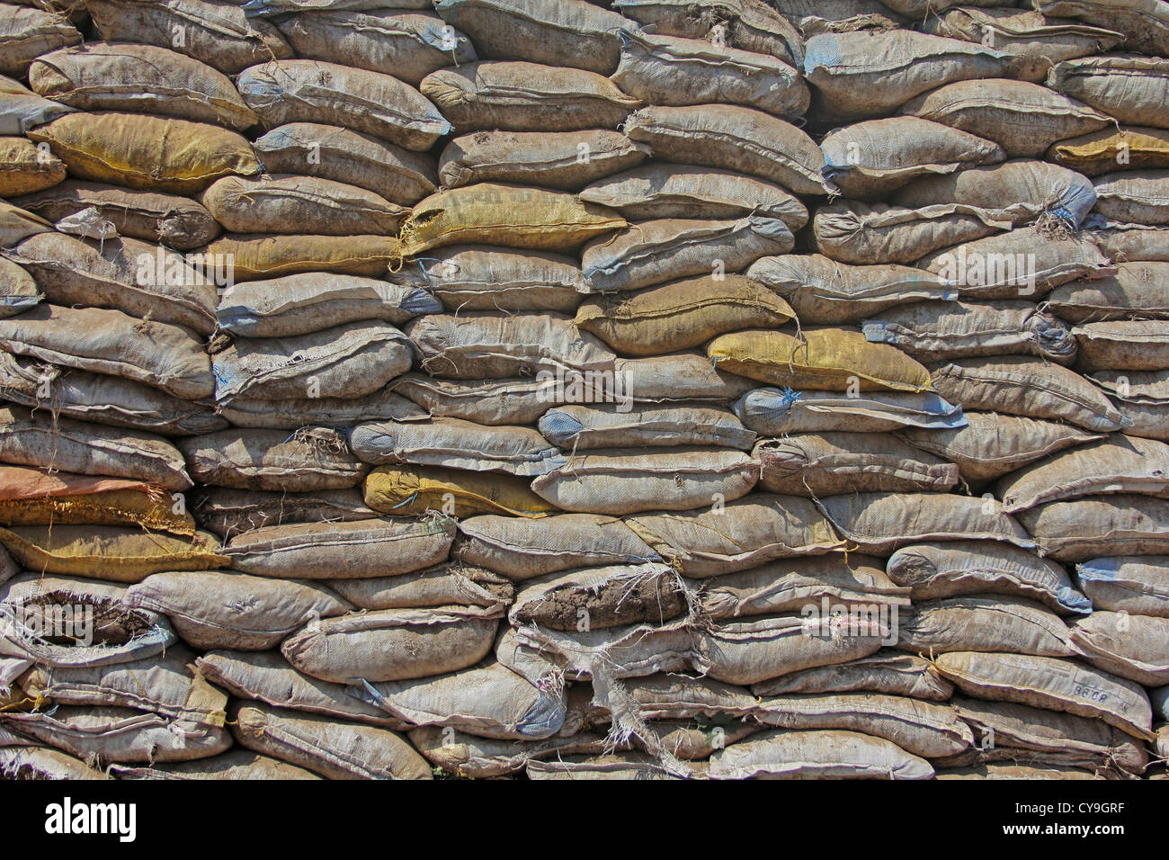 Pile of white sand bags on construction site Stock Photo - Alamy