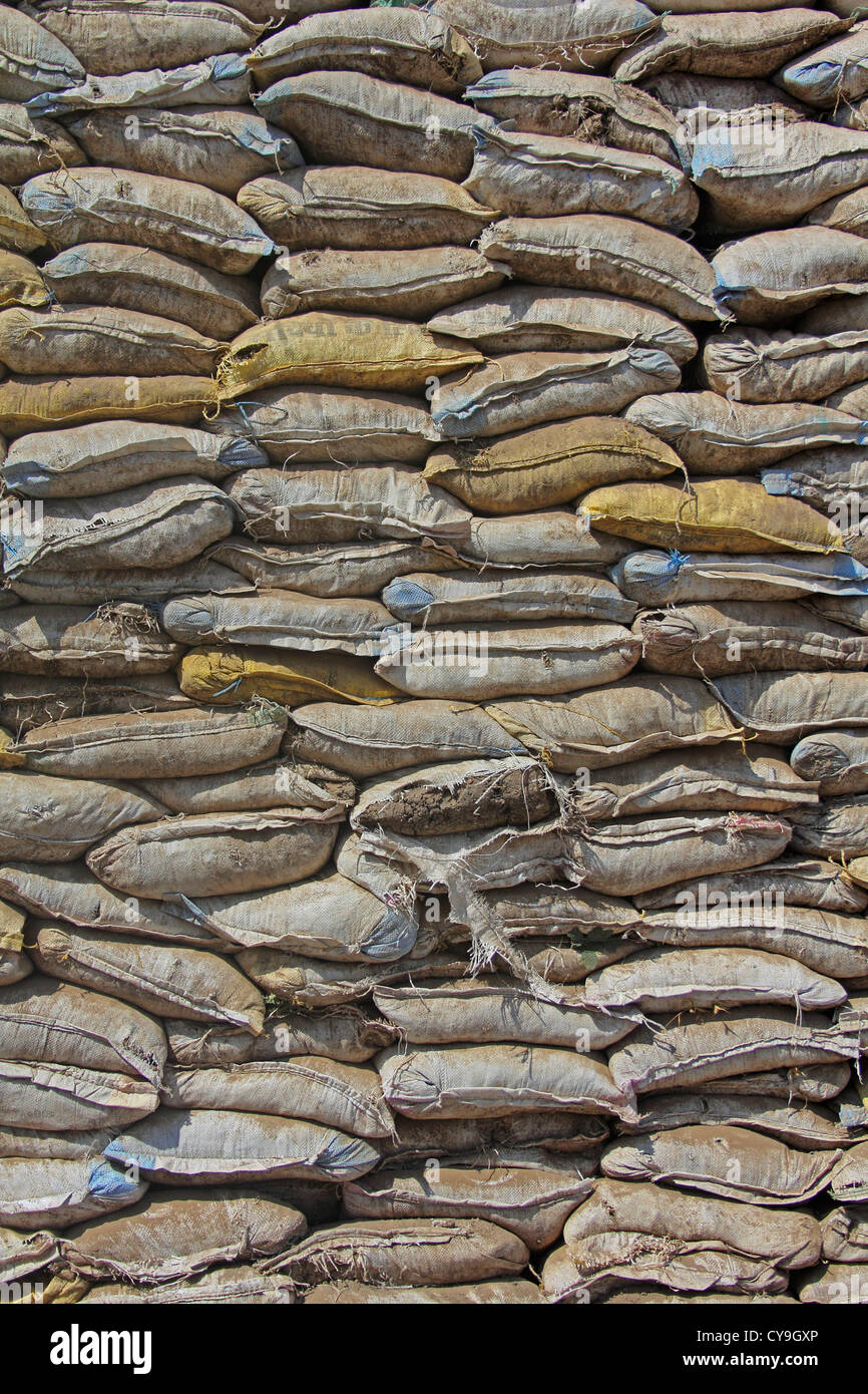Pile of white sand bags on construction site Stock Photo - Alamy