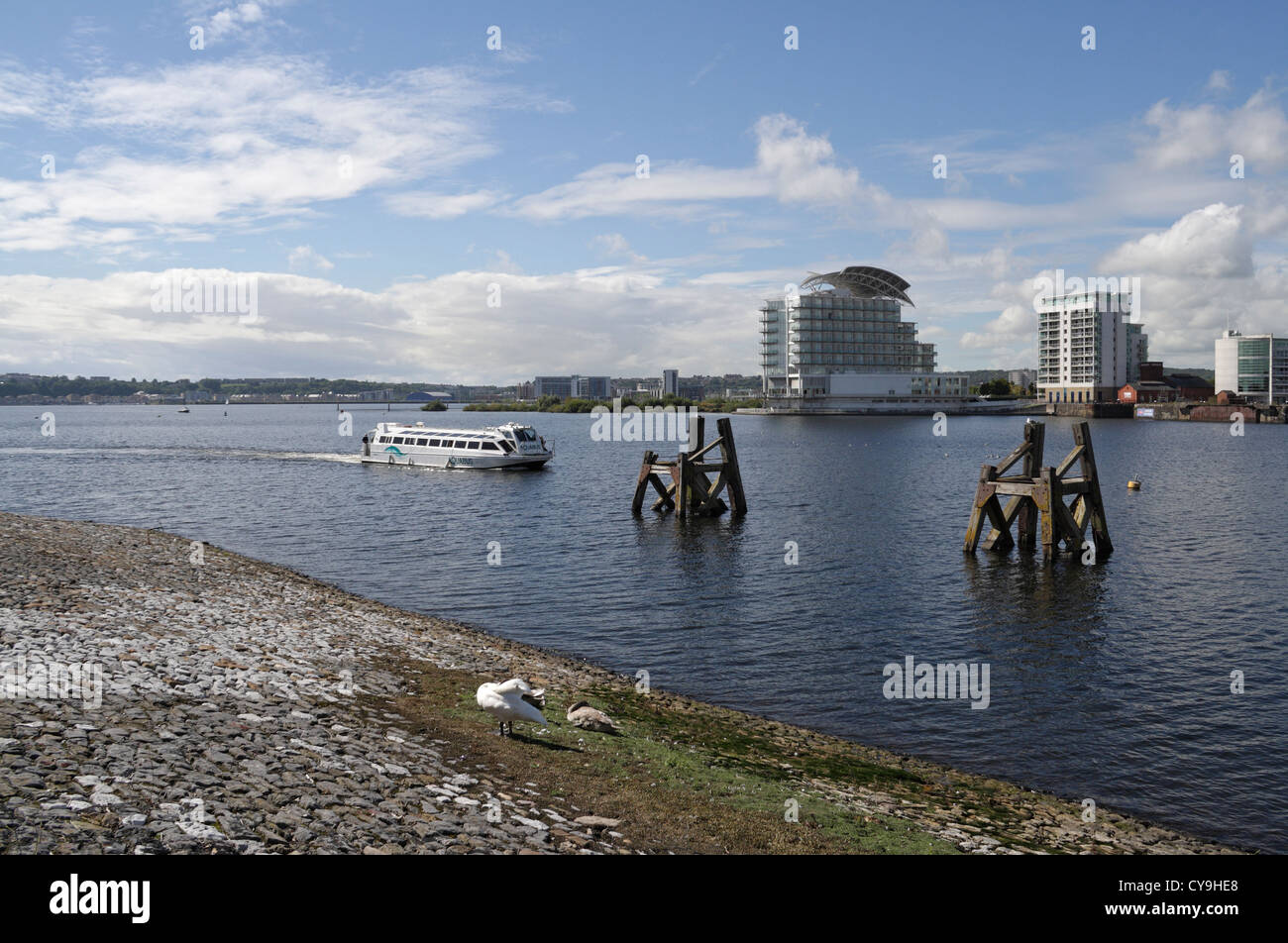 A waterbus coming into berth in Cardiff Bay, Wales UK View of barrage ...