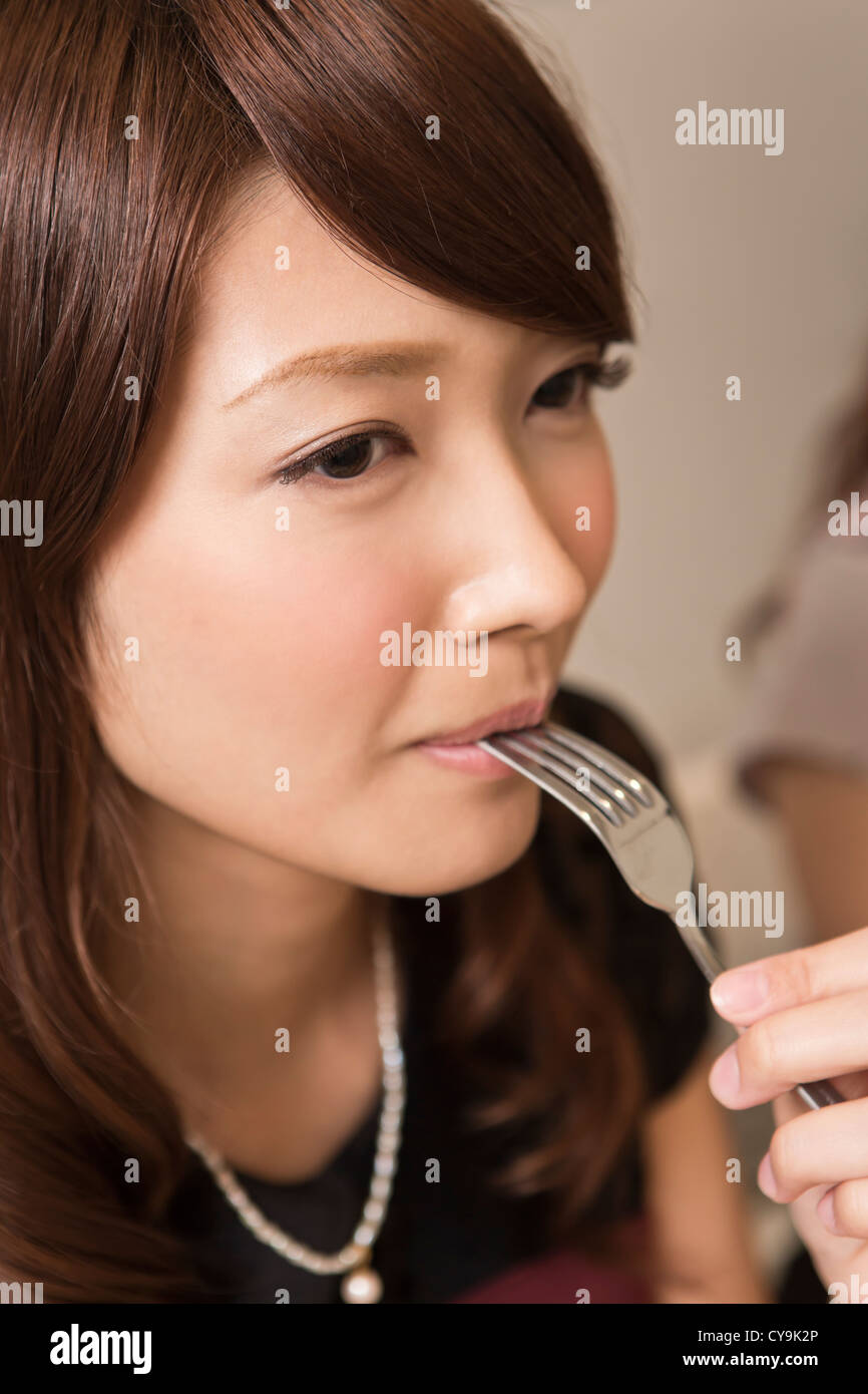 Fork in her mouth hi-res stock photography and images - Alamy