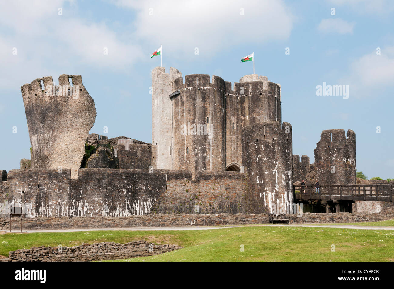 Wales, Caerphilly Castle, construction began 1268, Welsh Flags Stock ...