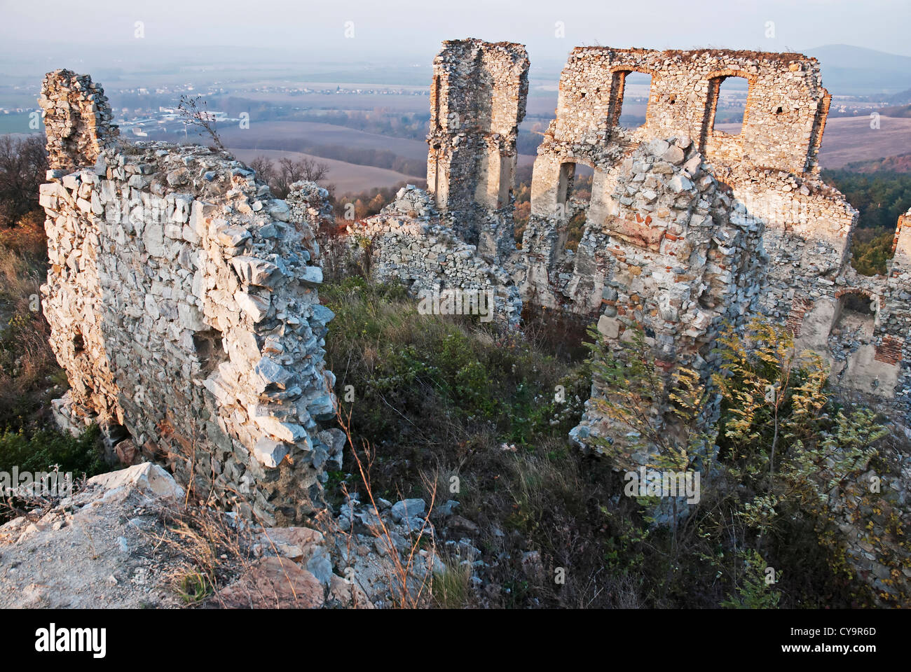 An old wall of ruined castle with a windows, sunset Stock Photo - Alamy