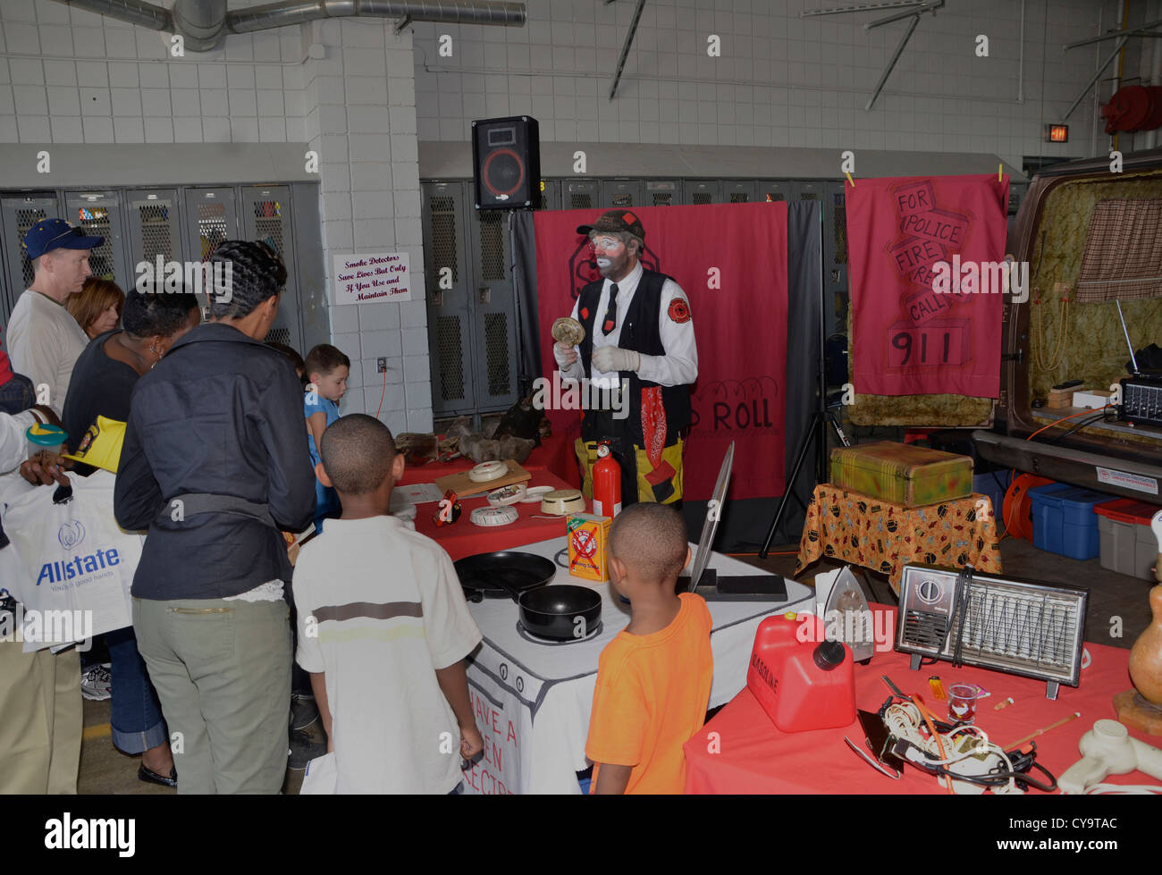 A fire department clown gives a speech on fire prevention at open house ...
