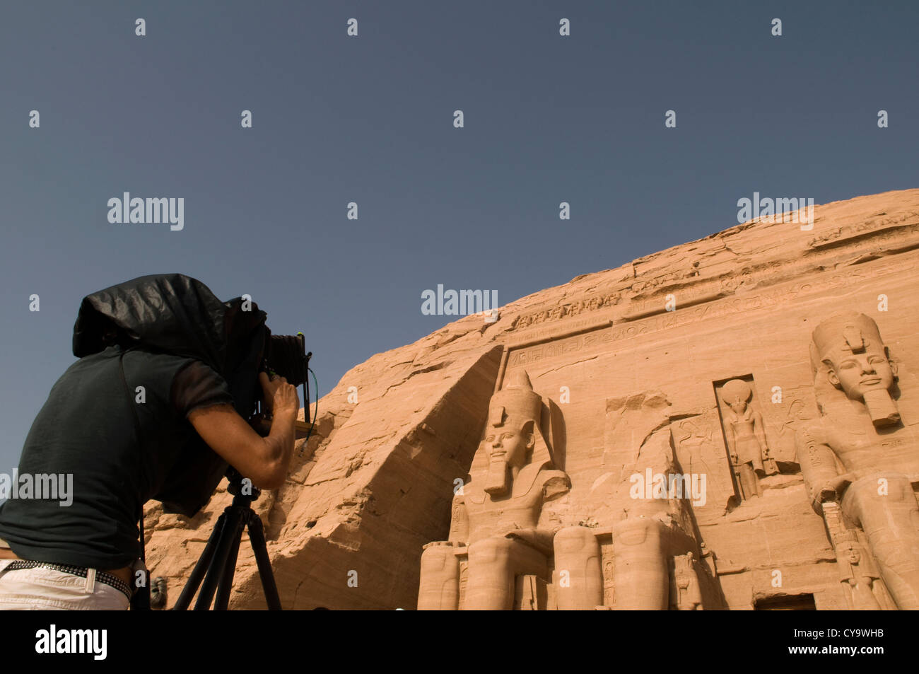 A tourist using an old 4x5 view camera to photograph the Sun Temple Of ...