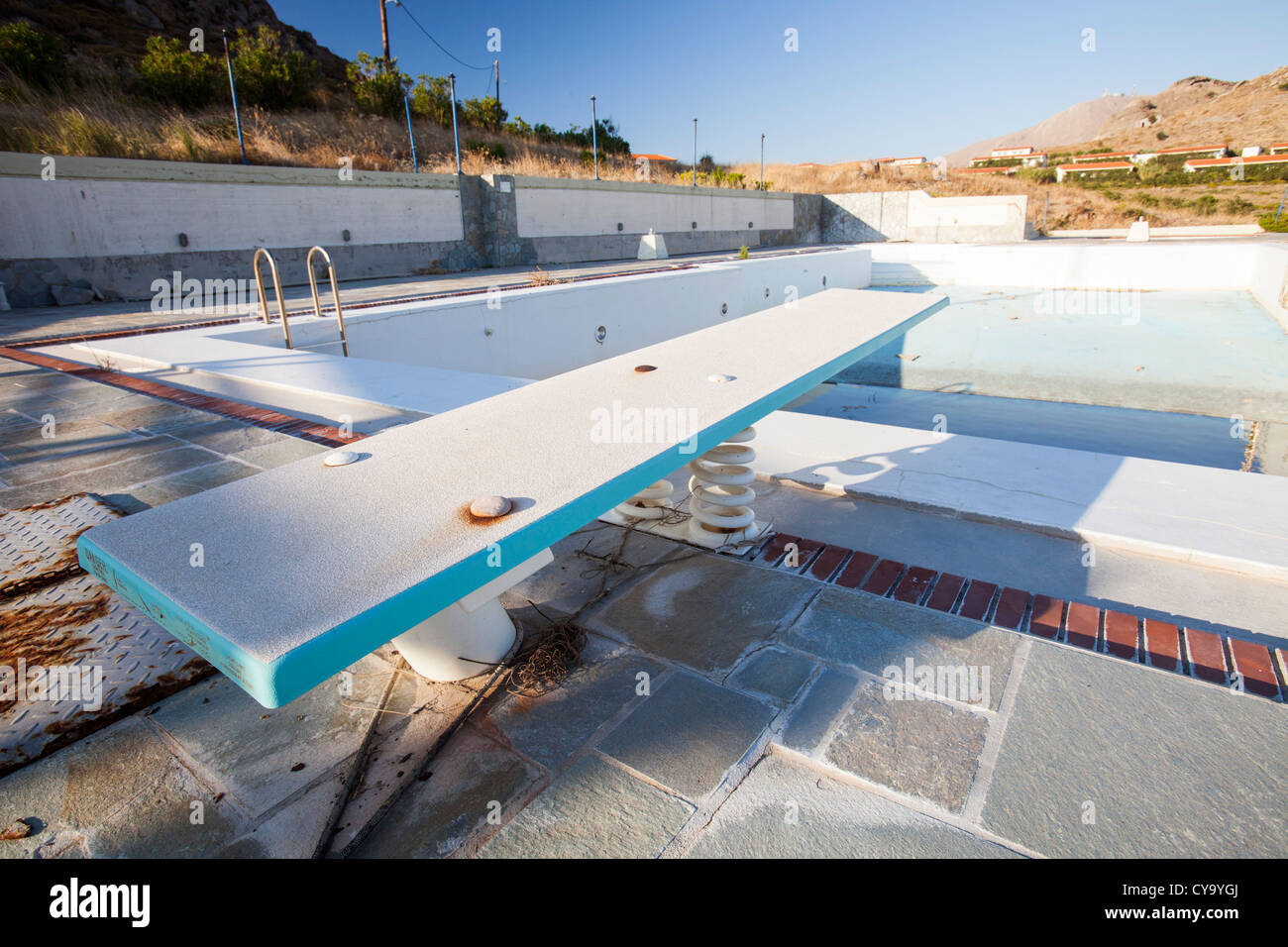 A derelict swimming pool at an abandoned holiday complex in Myrina on ...