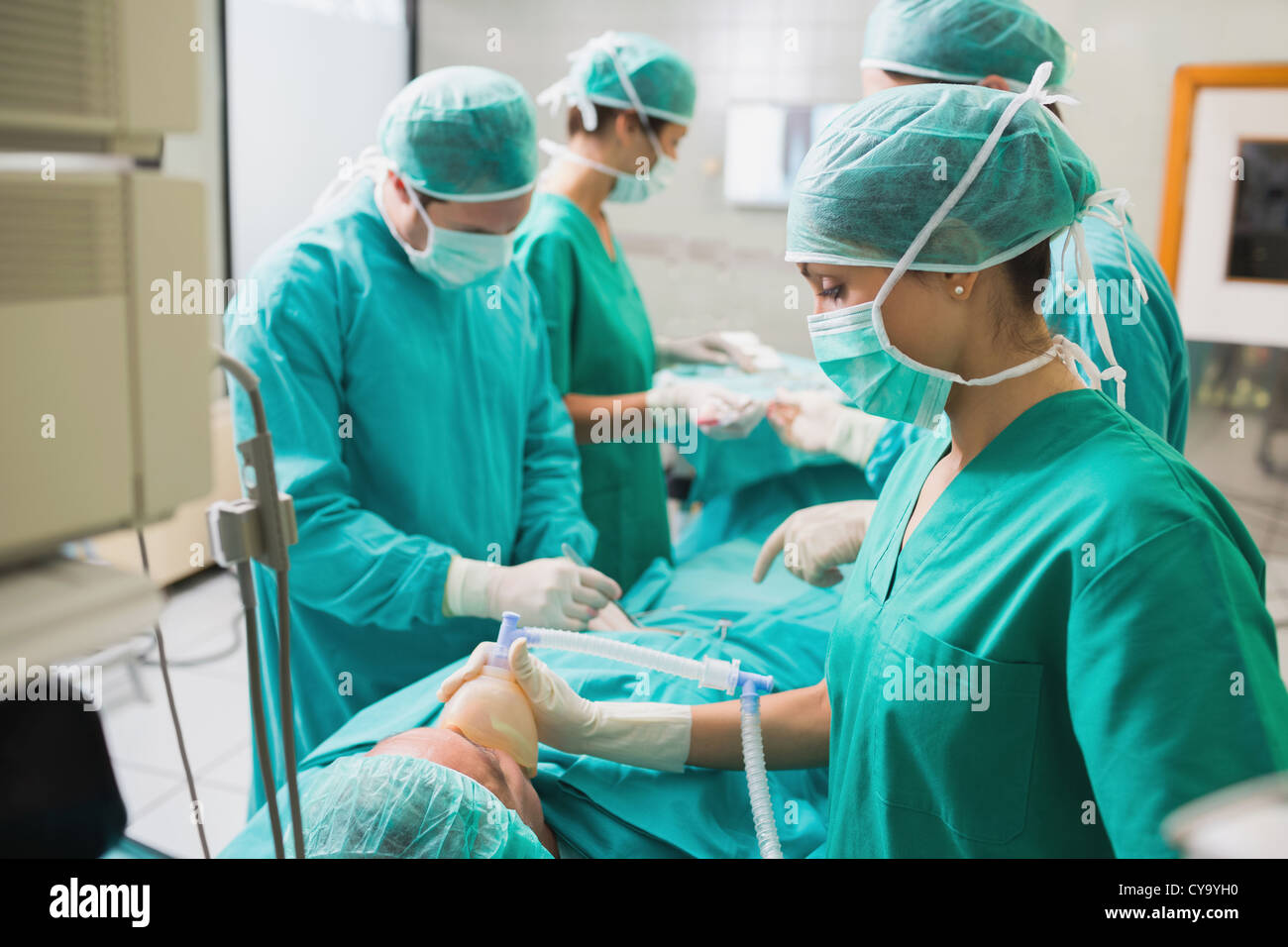 Surgical team at work Stock Photo - Alamy