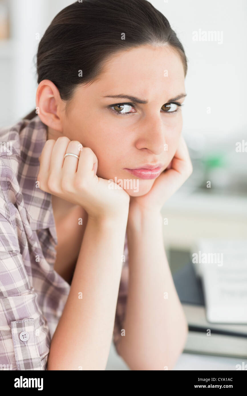 Upset woman looking at camera Stock Photo - Alamy