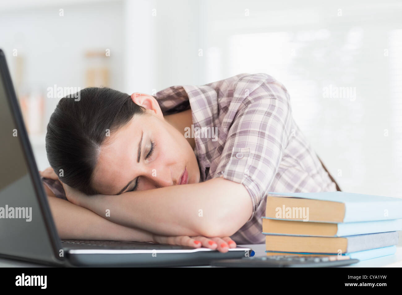 Woman resting on laptop Stock Photo - Alamy
