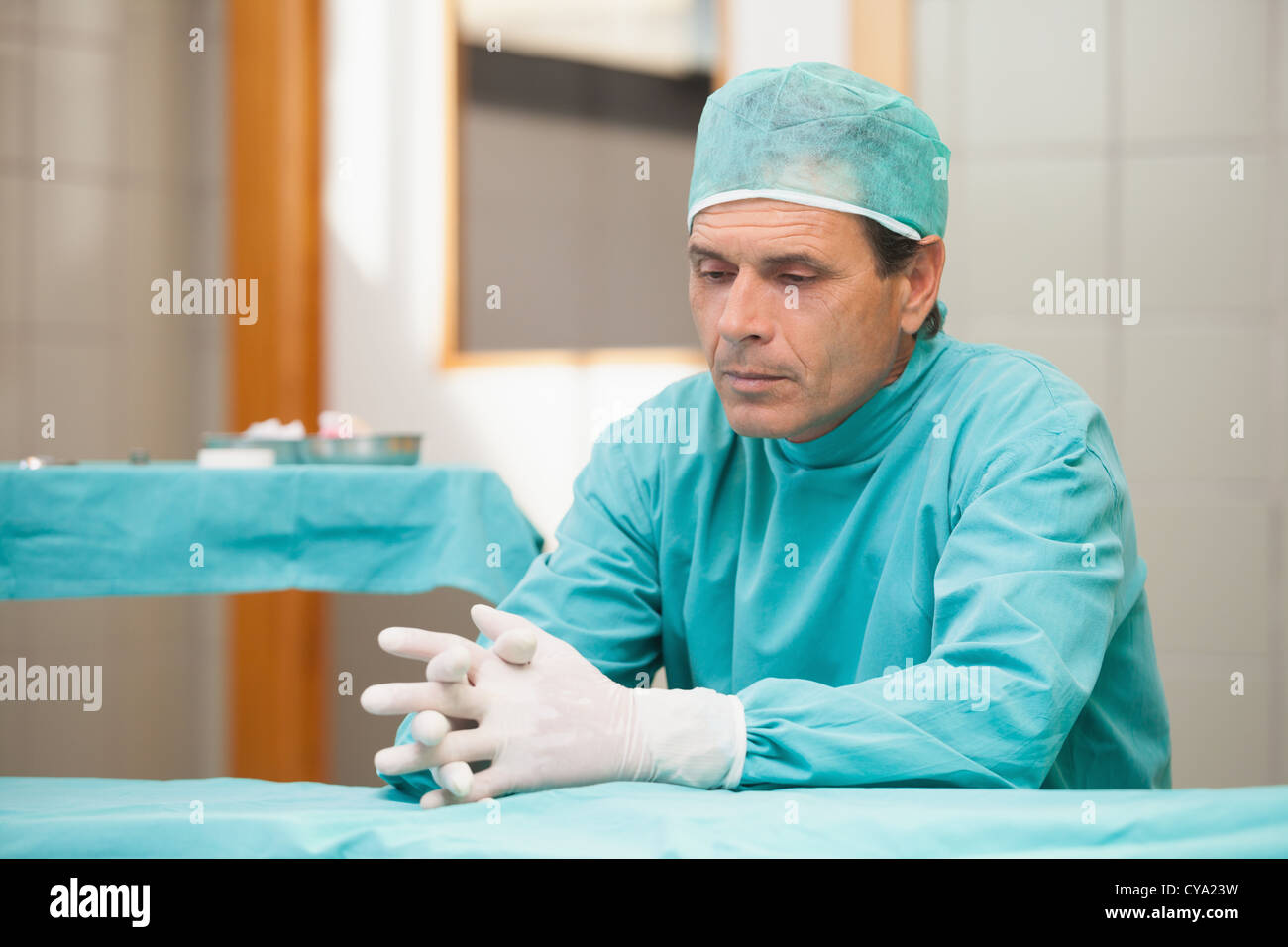 Thoughtful surgeon in a hospital Stock Photo - Alamy
