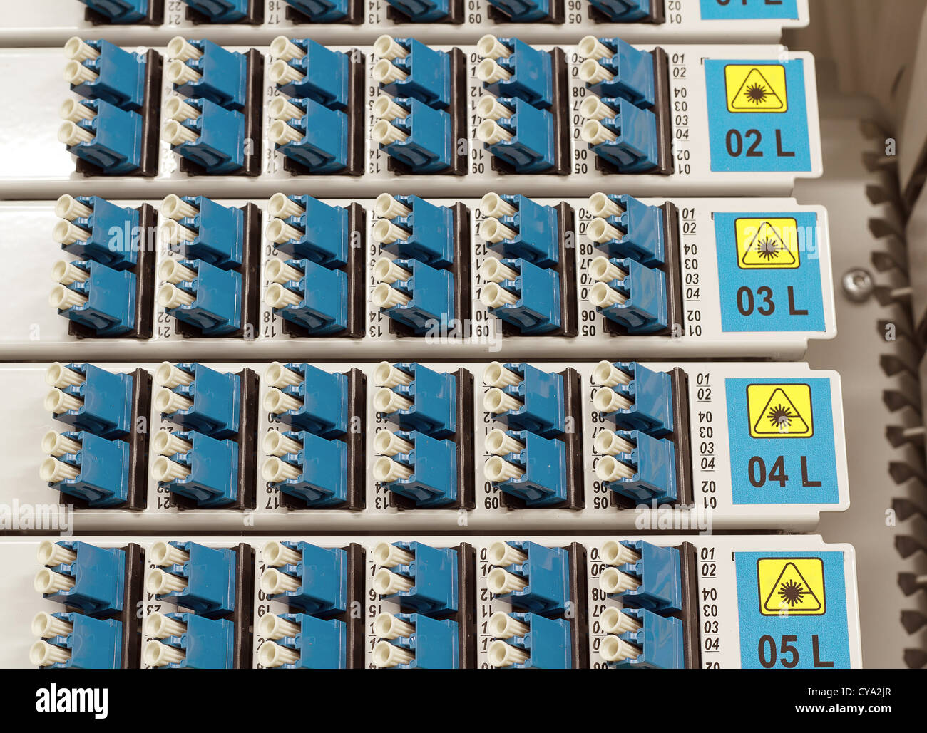 fiber optic cable management system with green and blue SC connectors ...