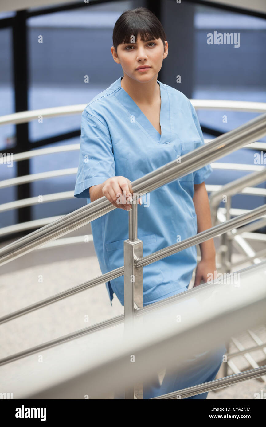 Nurse on the stairs Stock Photo - Alamy