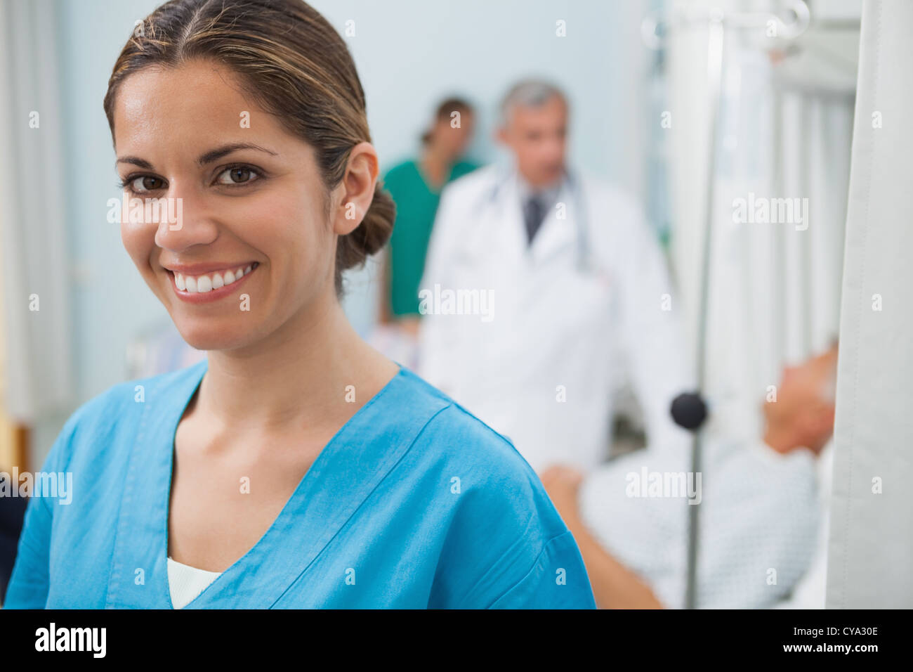 Smiling nurse in hospital room Stock Photo - Alamy
