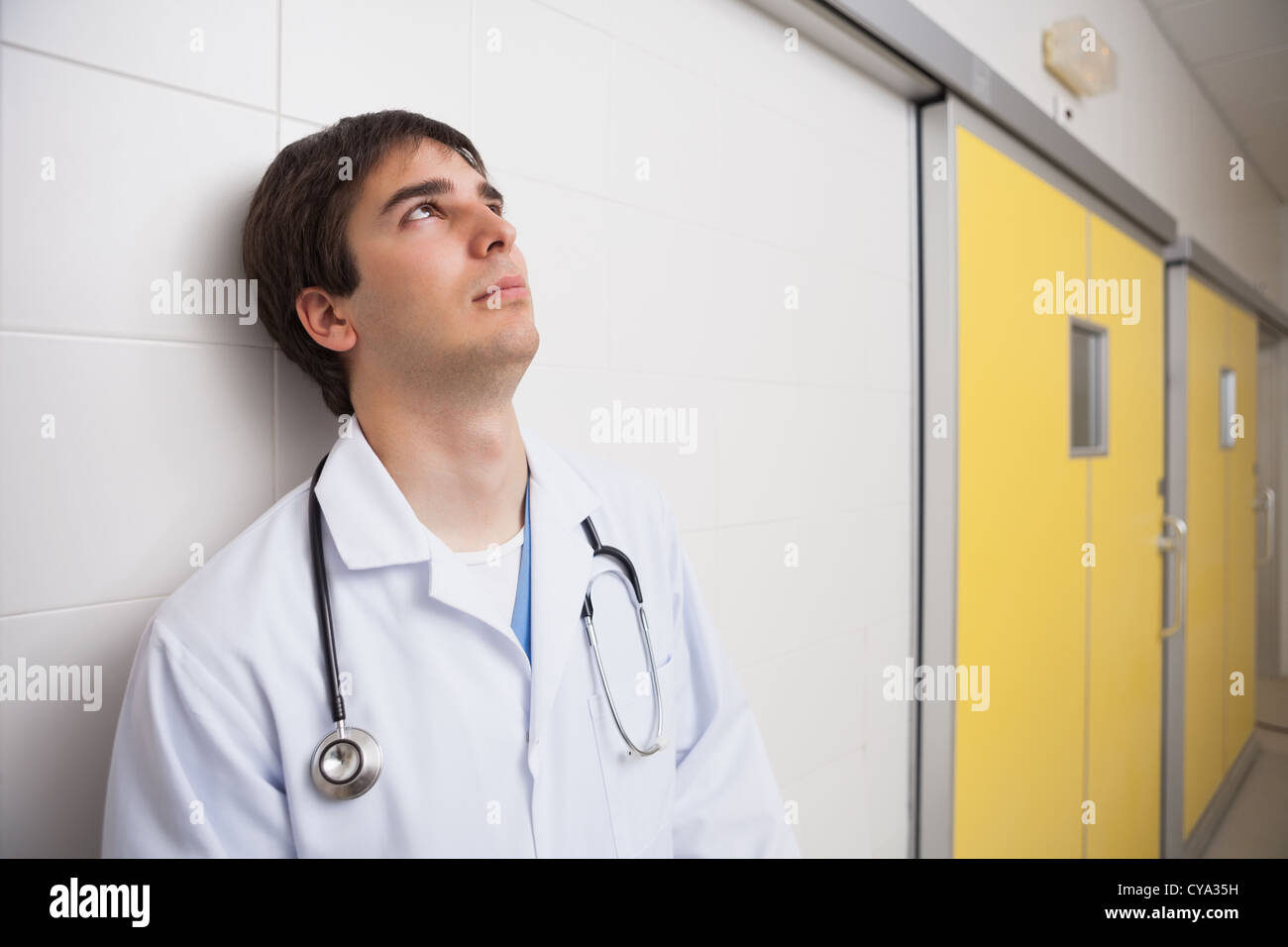 Doctor thinks while looking up Stock Photo - Alamy
