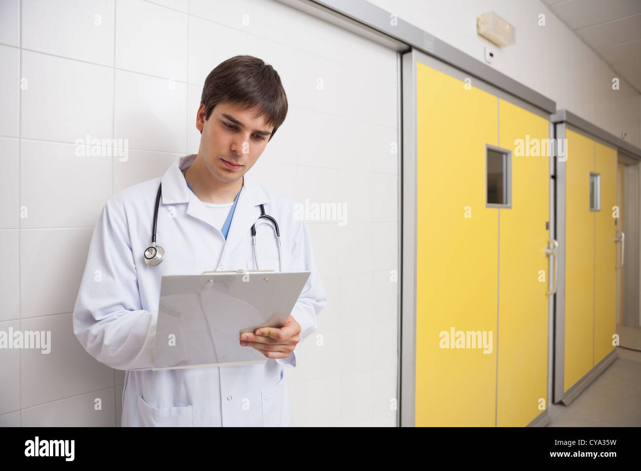 Doctor making notes Stock Photo - Alamy