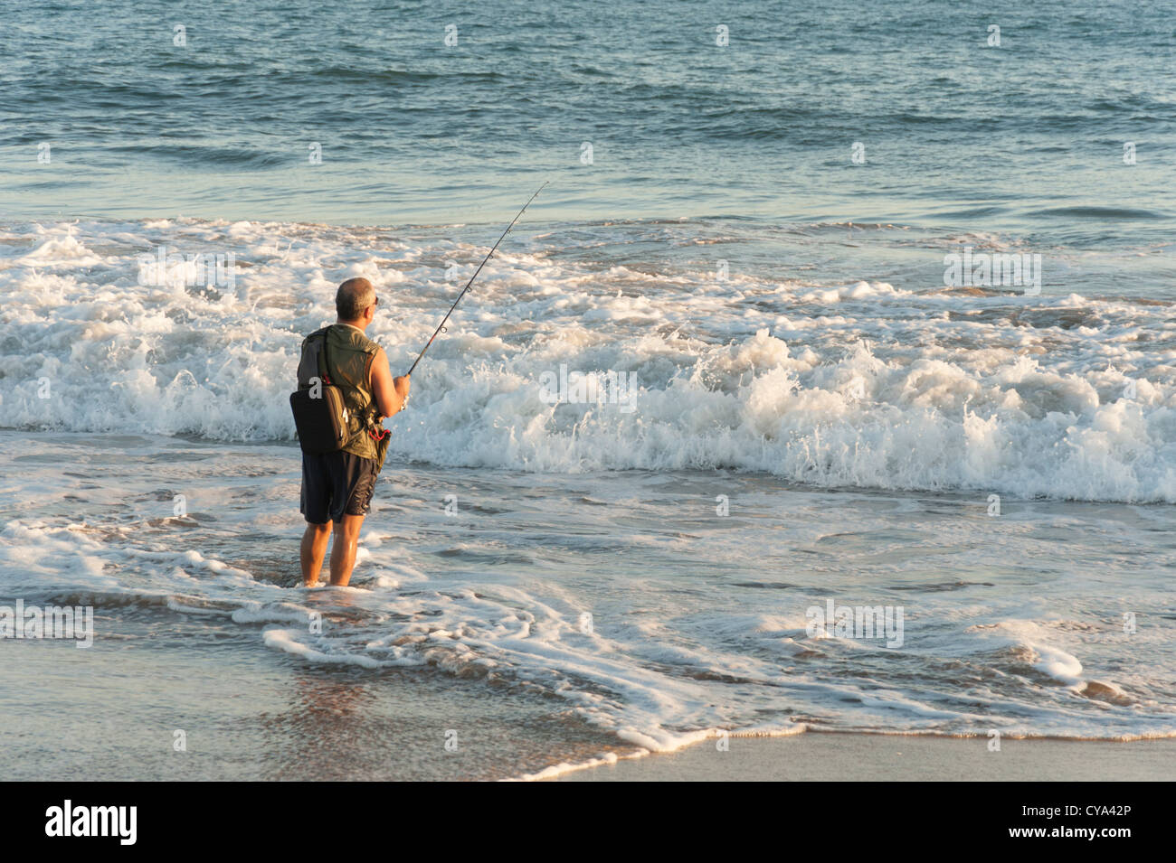 Fisherman angler fishing on beach hi-res stock photography and images ...