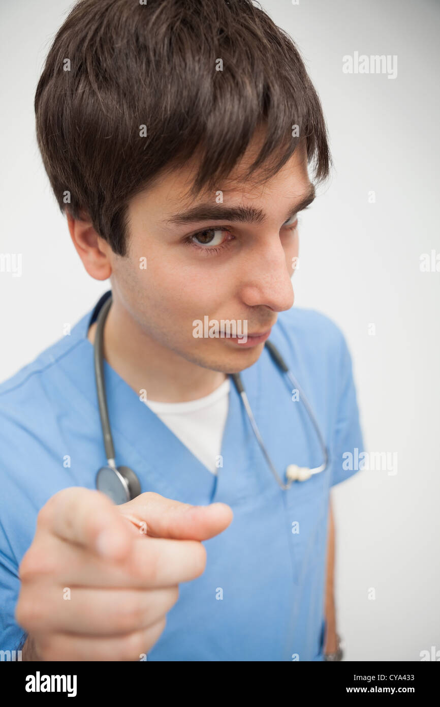 Male nurse is pointing at camera Stock Photo - Alamy