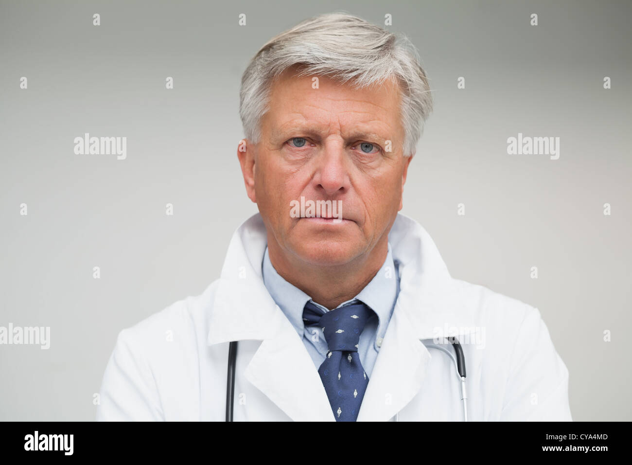 Mature doctor looking serious Stock Photo - Alamy Mature doctor looking serious Stock Photo - Alamy