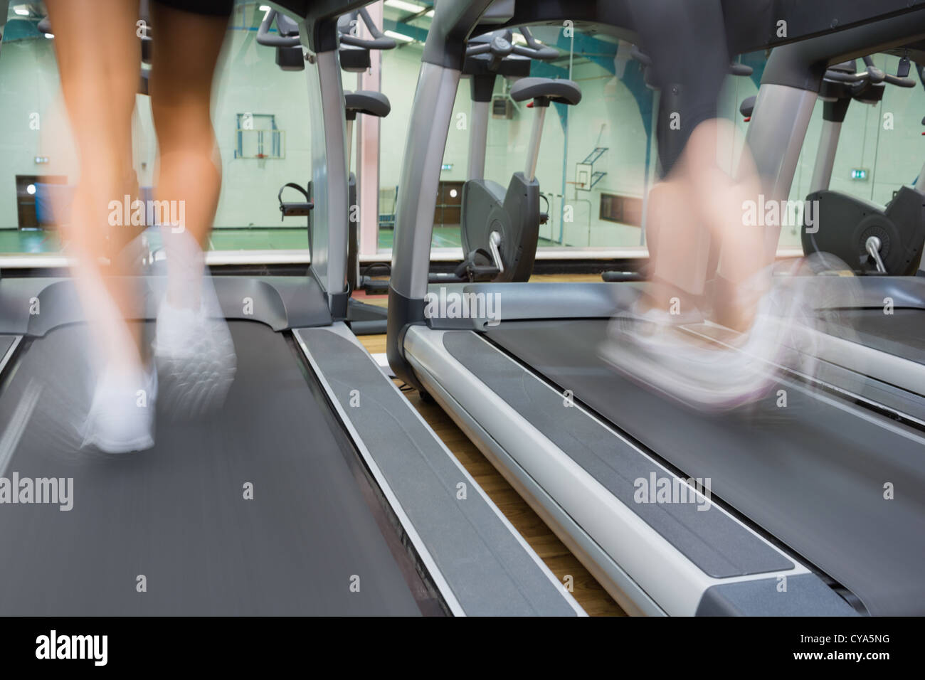 Running on a treadmill in the gym Stock Photo - Alamy