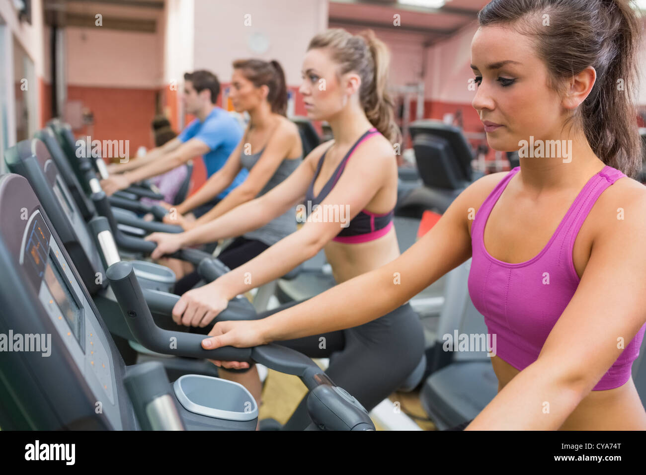 People exercising on exercise bicycles Stock Photo - Alamy